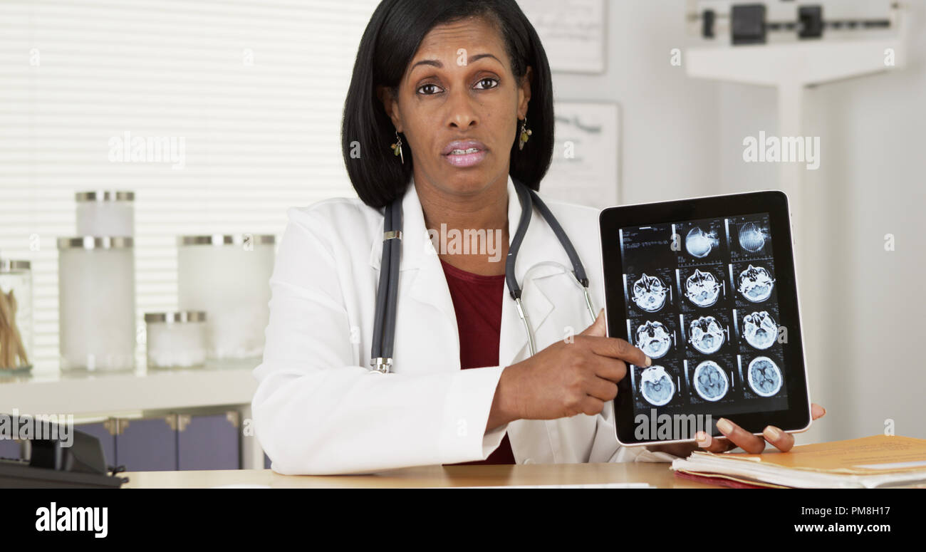 African american doctor showing tablet hi-res stock photography and ...