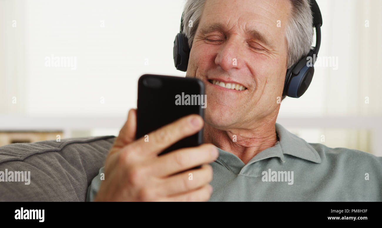 Senior man wearing head phones hi-res stock photography and images - Alamy