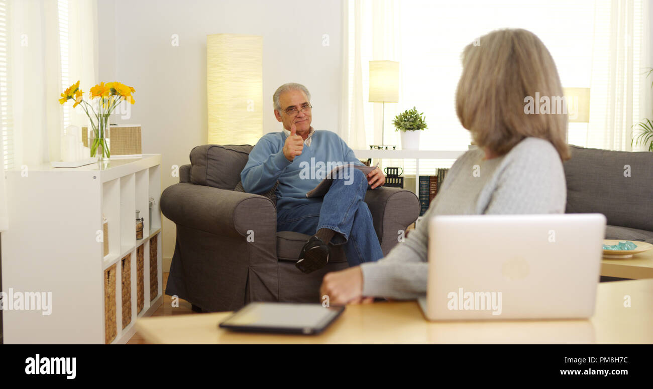 Senior adults using electronic devices at home Stock Photo - Alamy
