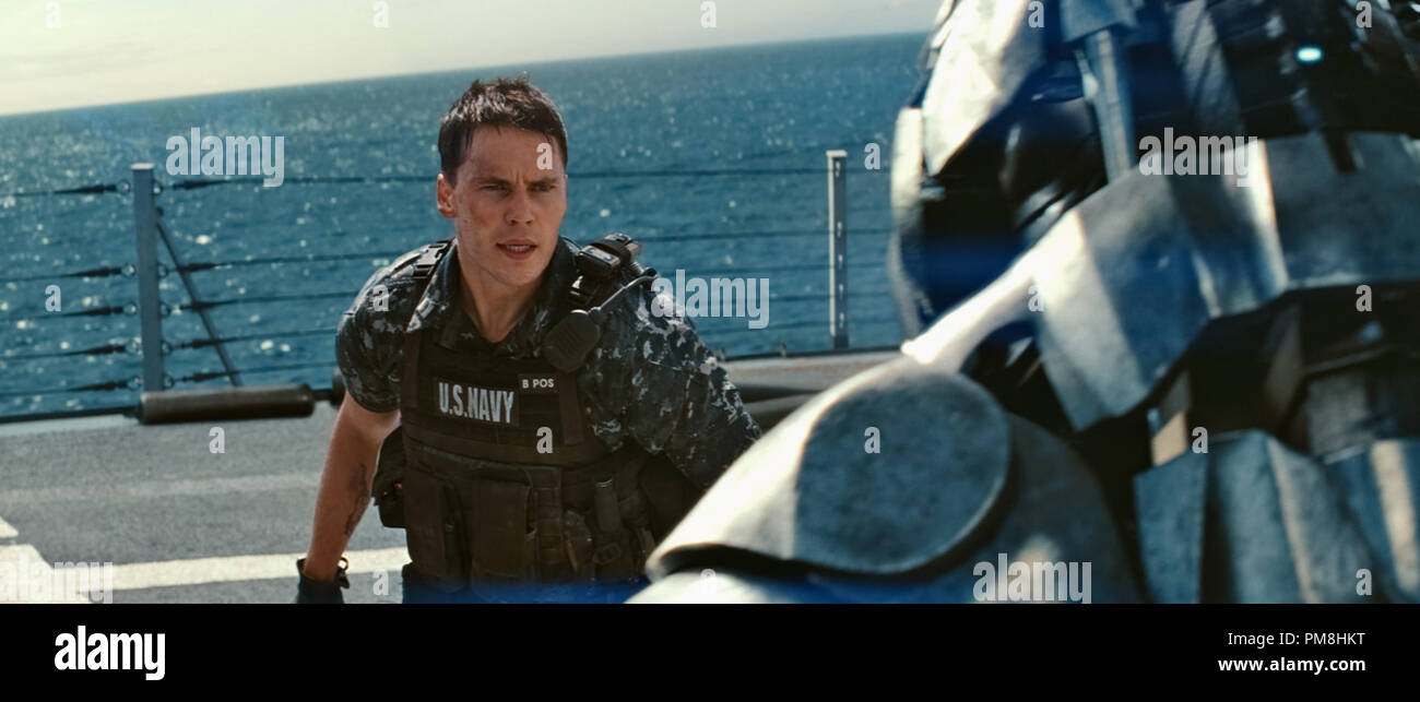 Hopper (TAYLOR KITSCH) squares off against an alien invader in ...