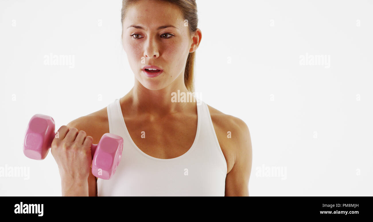Healthy Fit Woman fitness trainer lifting weights Stock Photo - Alamy