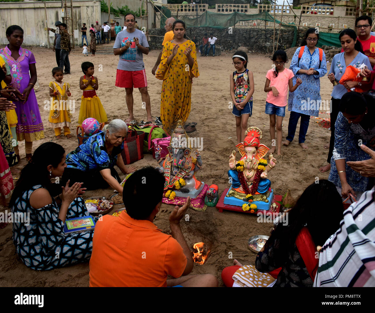 Indian Hindu devotees seen praying before an idol for immersion during ...