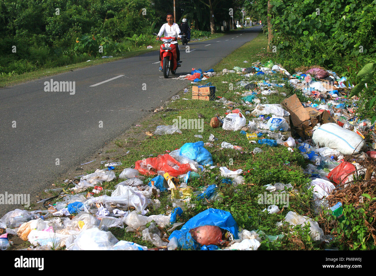 Piles of plastic waste seen on the side of the road due to littering by ...