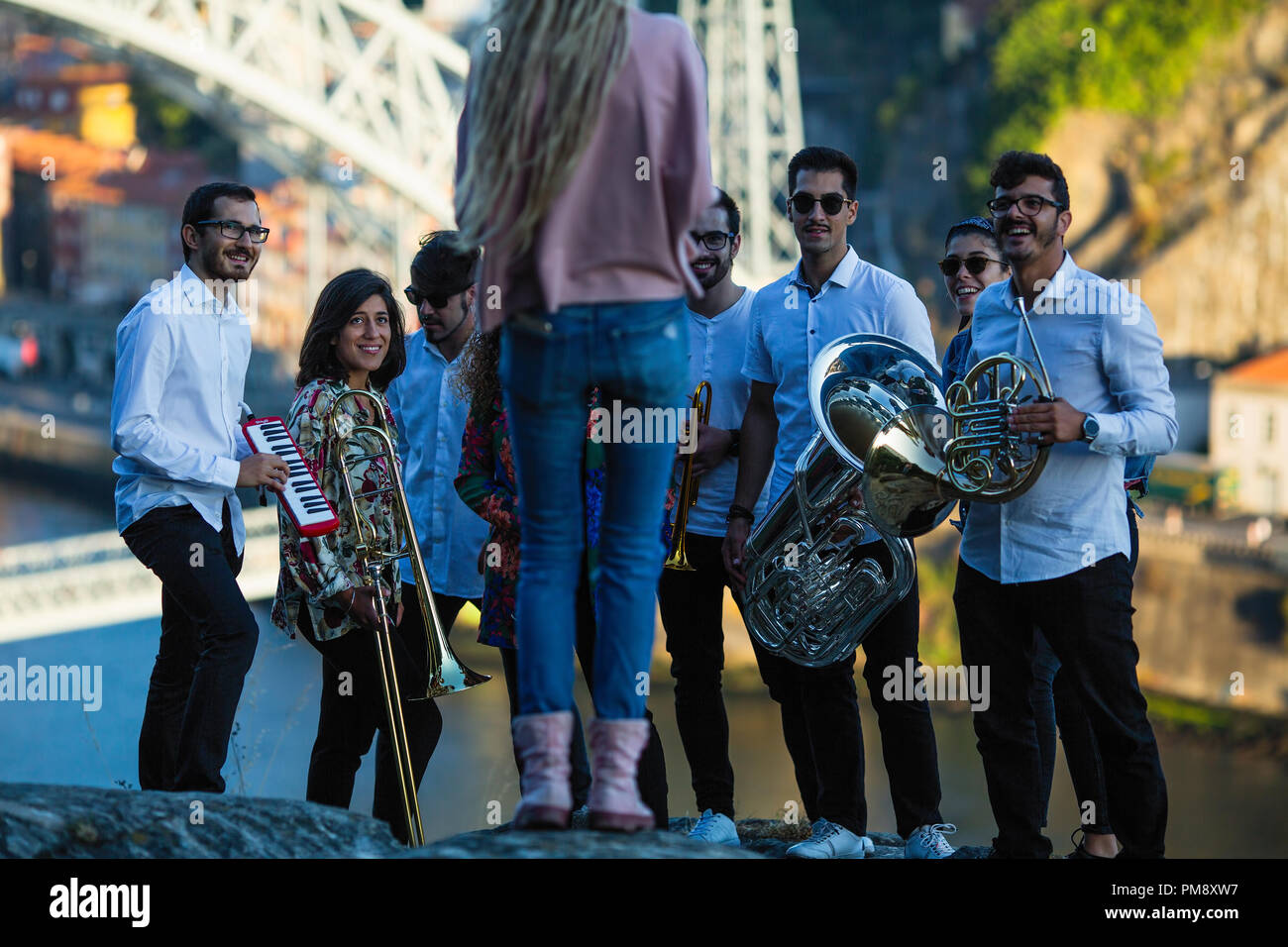 Girl photographer shoots the performance of the jazz band in outdoor ...