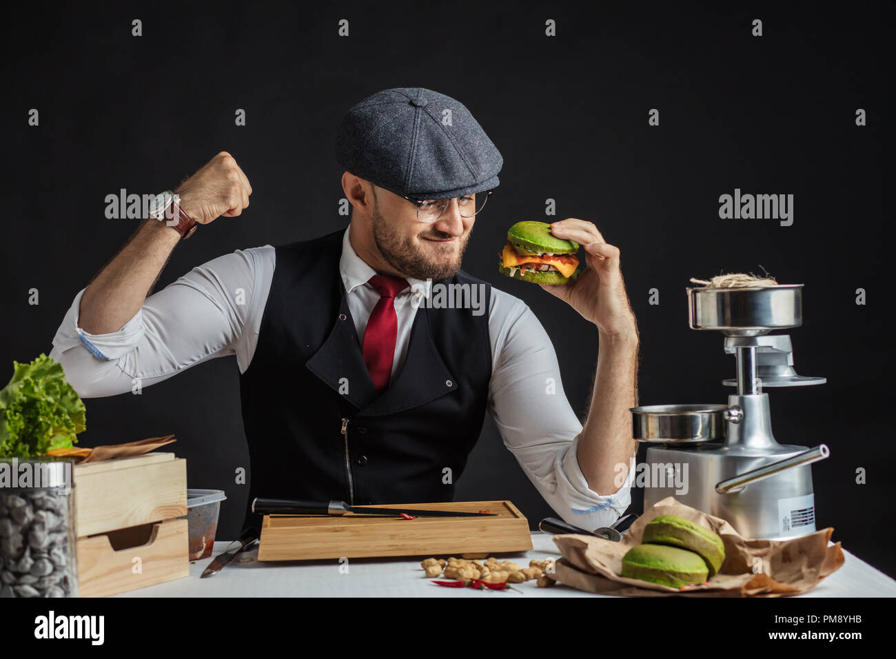Food lover enjoys ready made self cooking of burgers and then Stock ...