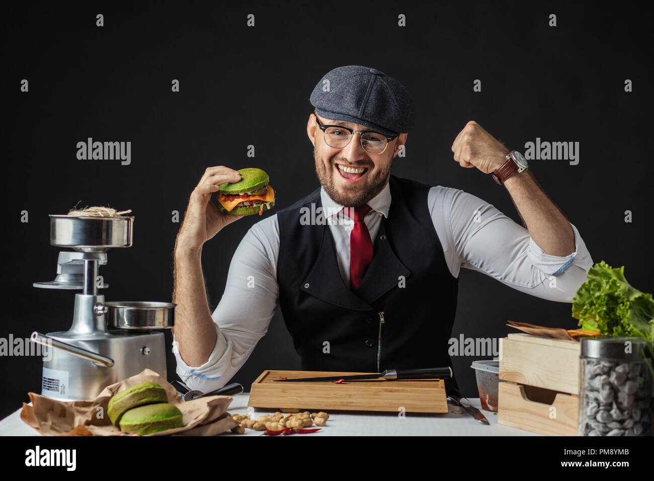 Food lover enjoys ready made self cooking of burgers and then Stock ...
