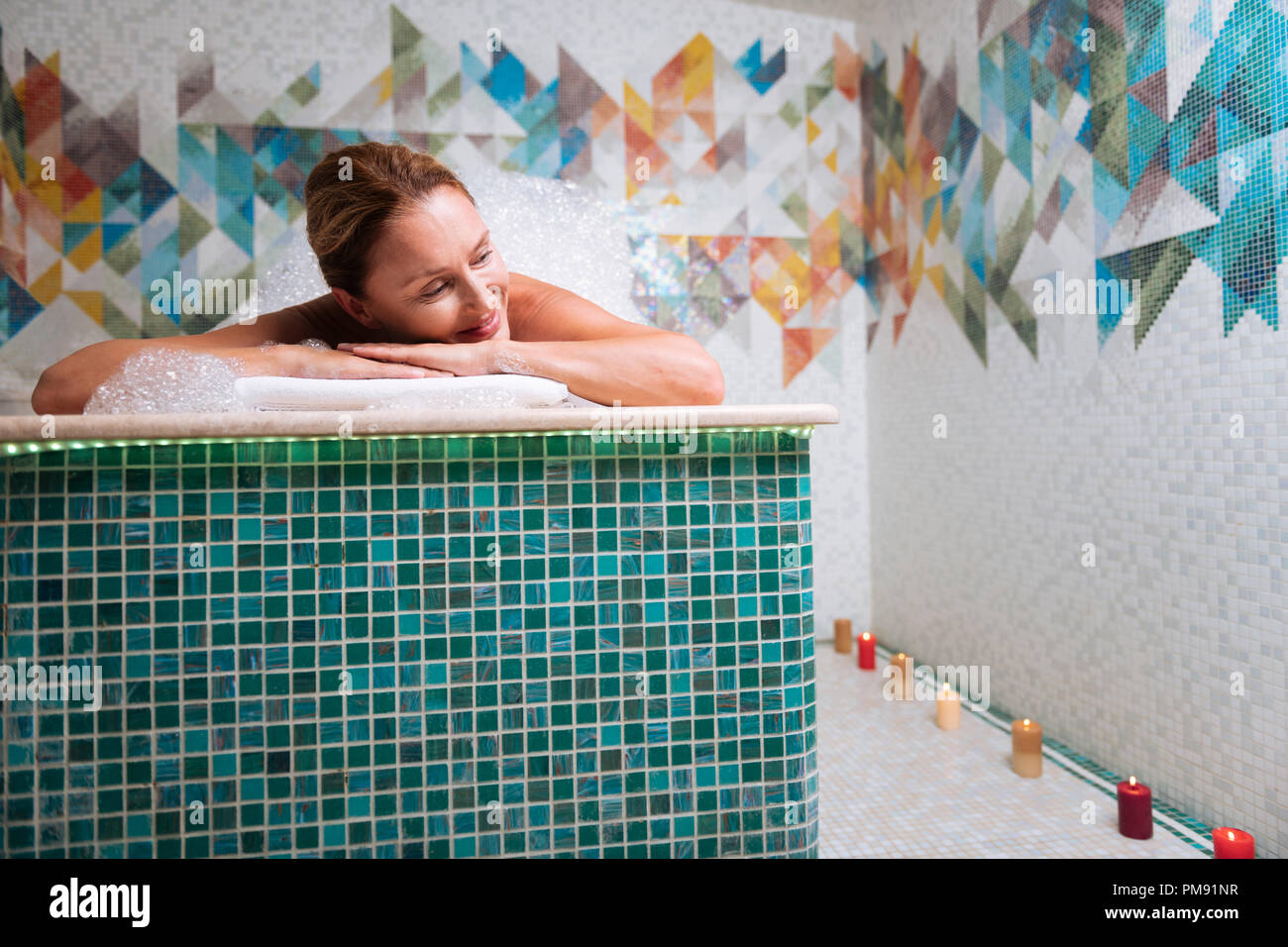 Happy nice woman being in a good mood Stock Photo - Alamy