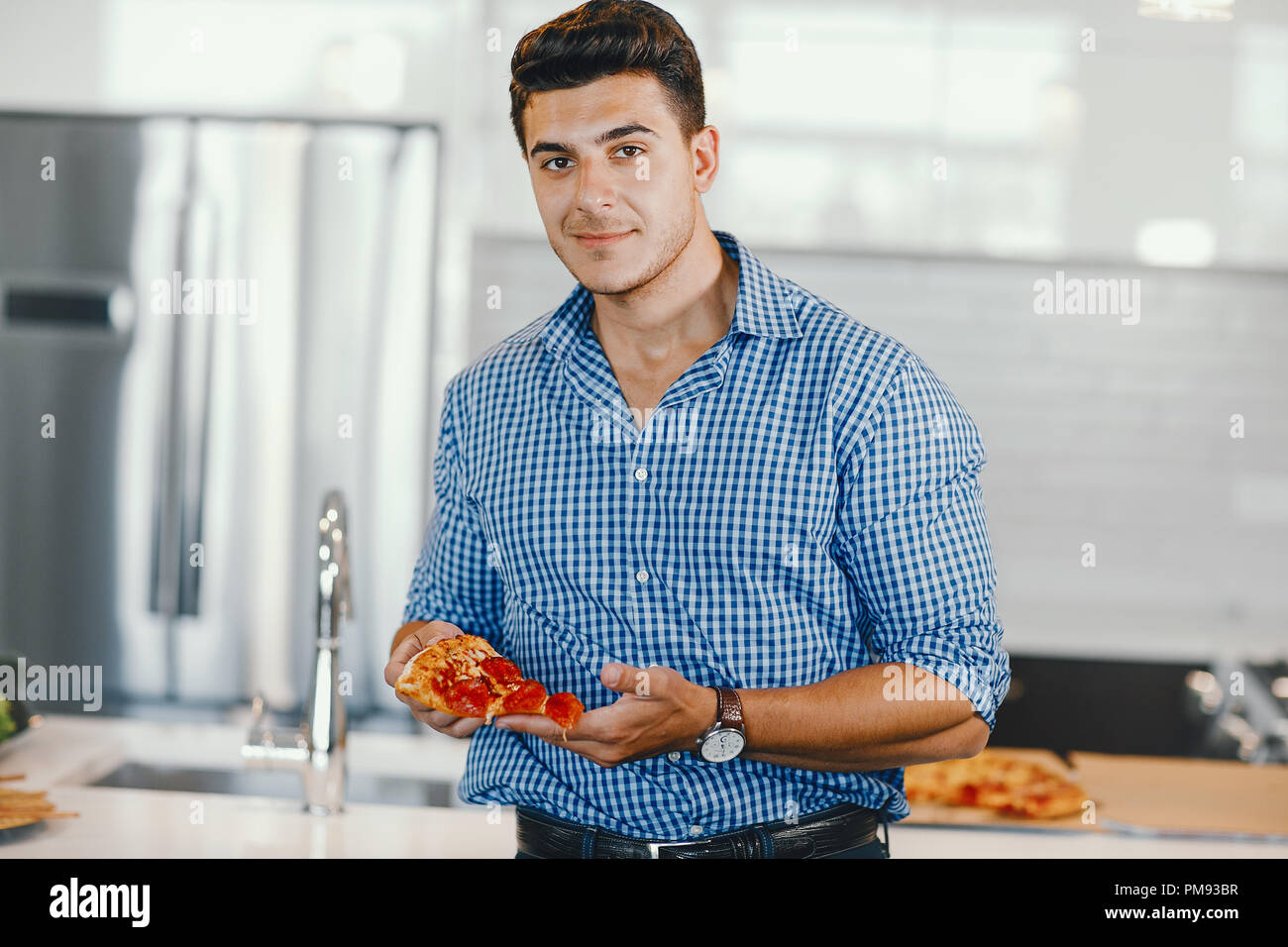Holding pizza slice hi-res stock photography and images - Alamy