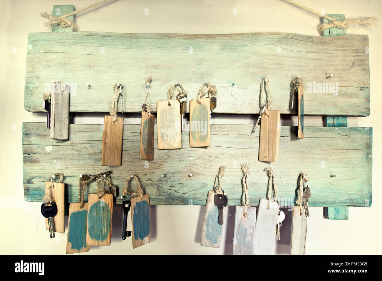 Wooden stylish key hanger. Furniture at home concept Stock Photo - Alamy