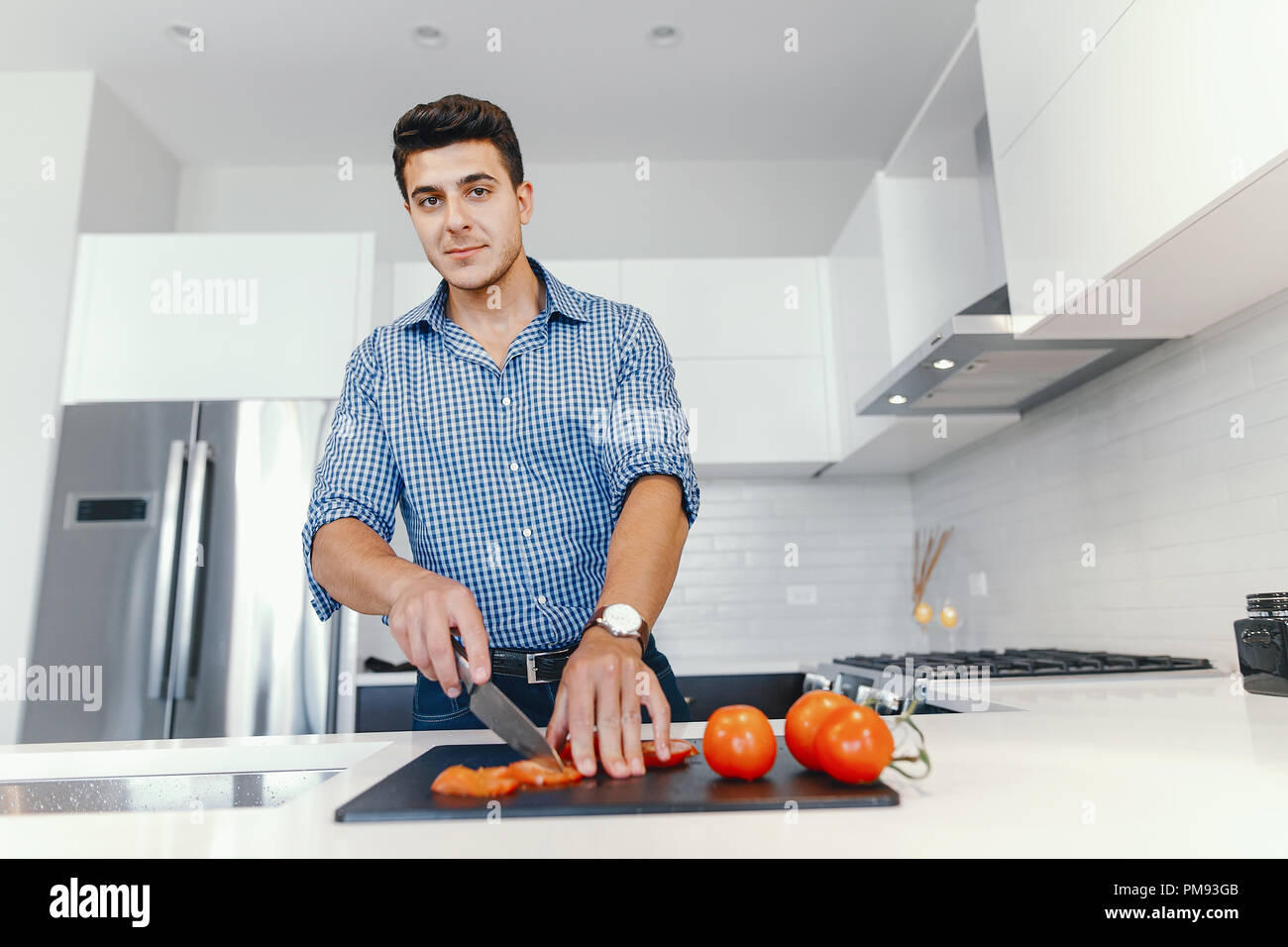Male home cook in kitchen hi-res stock photography and images - Alamy