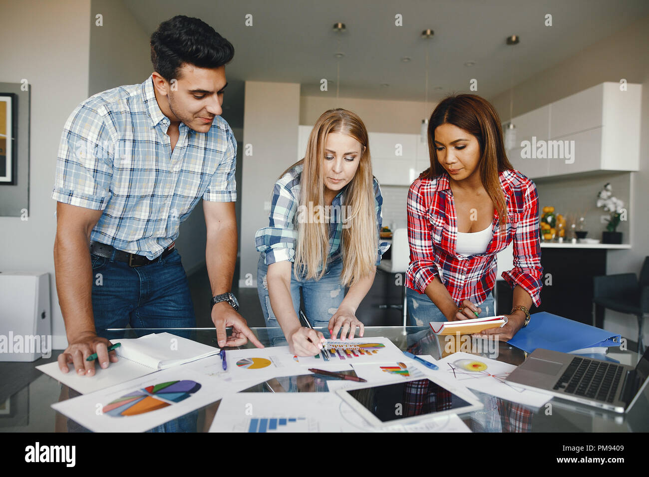 three partners at the office Stock Photo - Alamy
