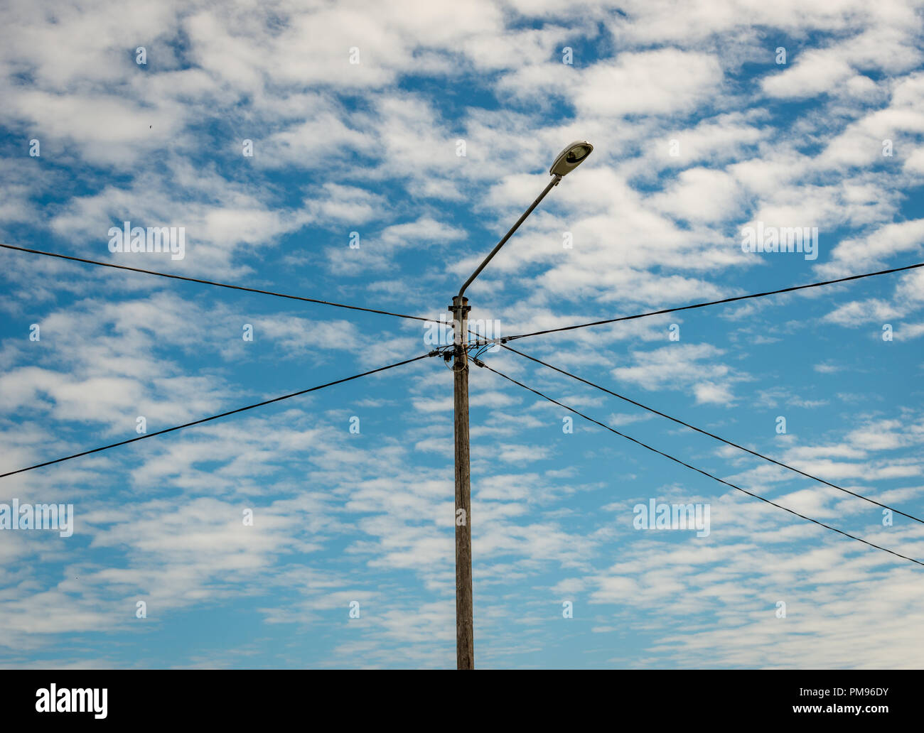 Lightpost with electrical wires connecting in a cross Stock Photo - Alamy