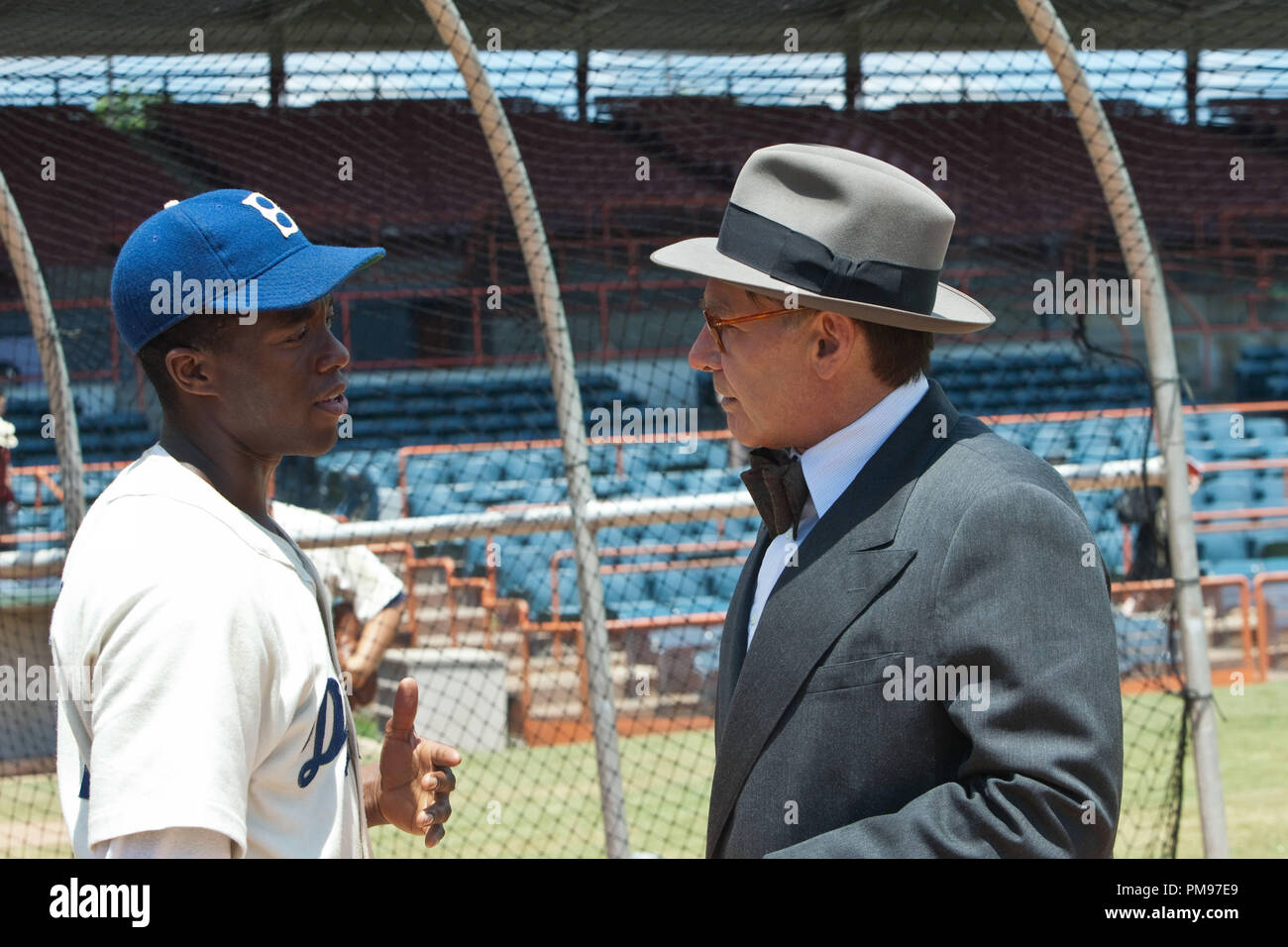 (L-r) CHADWICK BOSEMAN as Jackie Robinson and HARRISON FORD as Branch ...