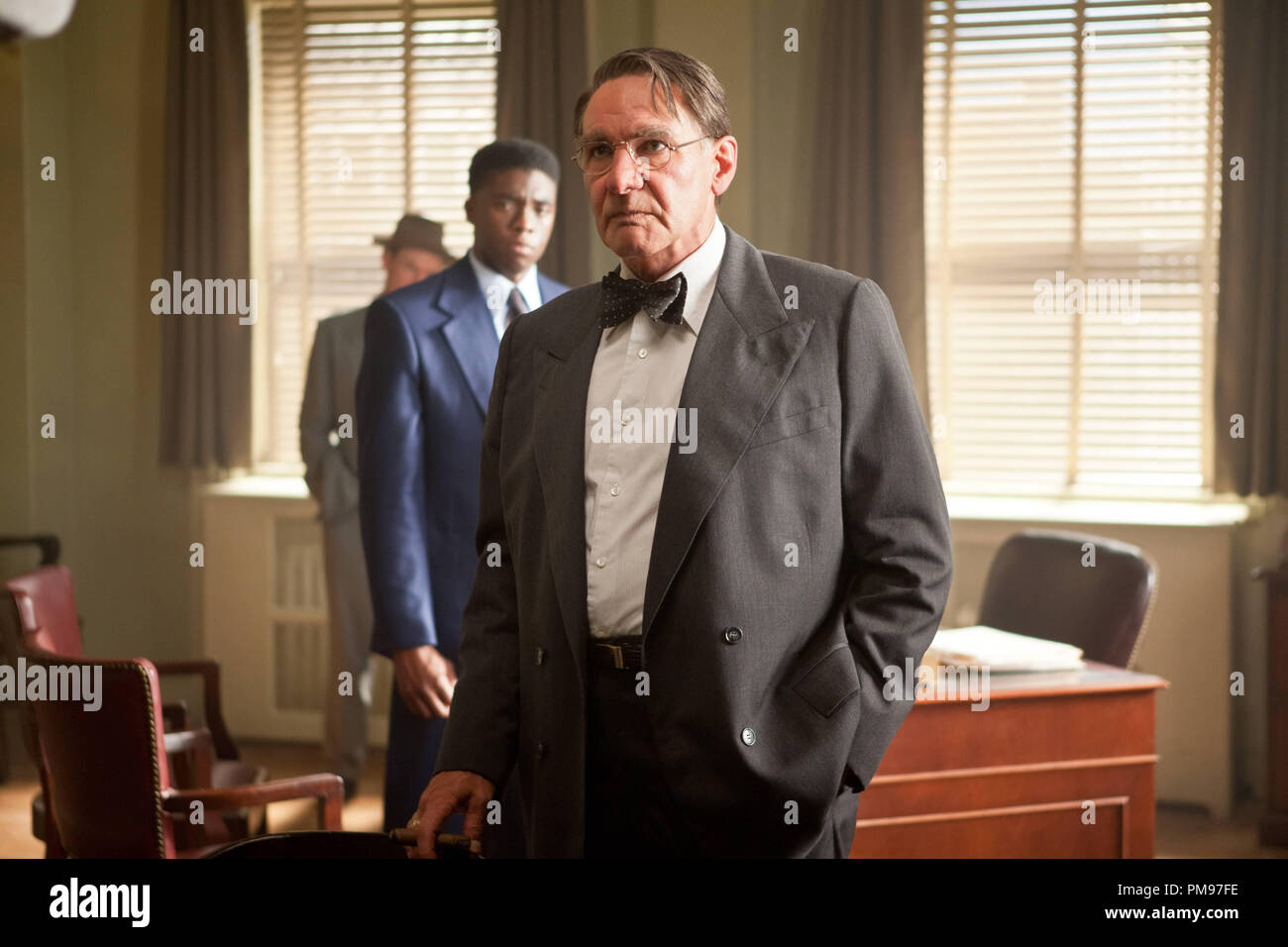 (L-r) CHADWICK BOSEMAN as Jackie Robinson and HARRISON FORD as Branch ...