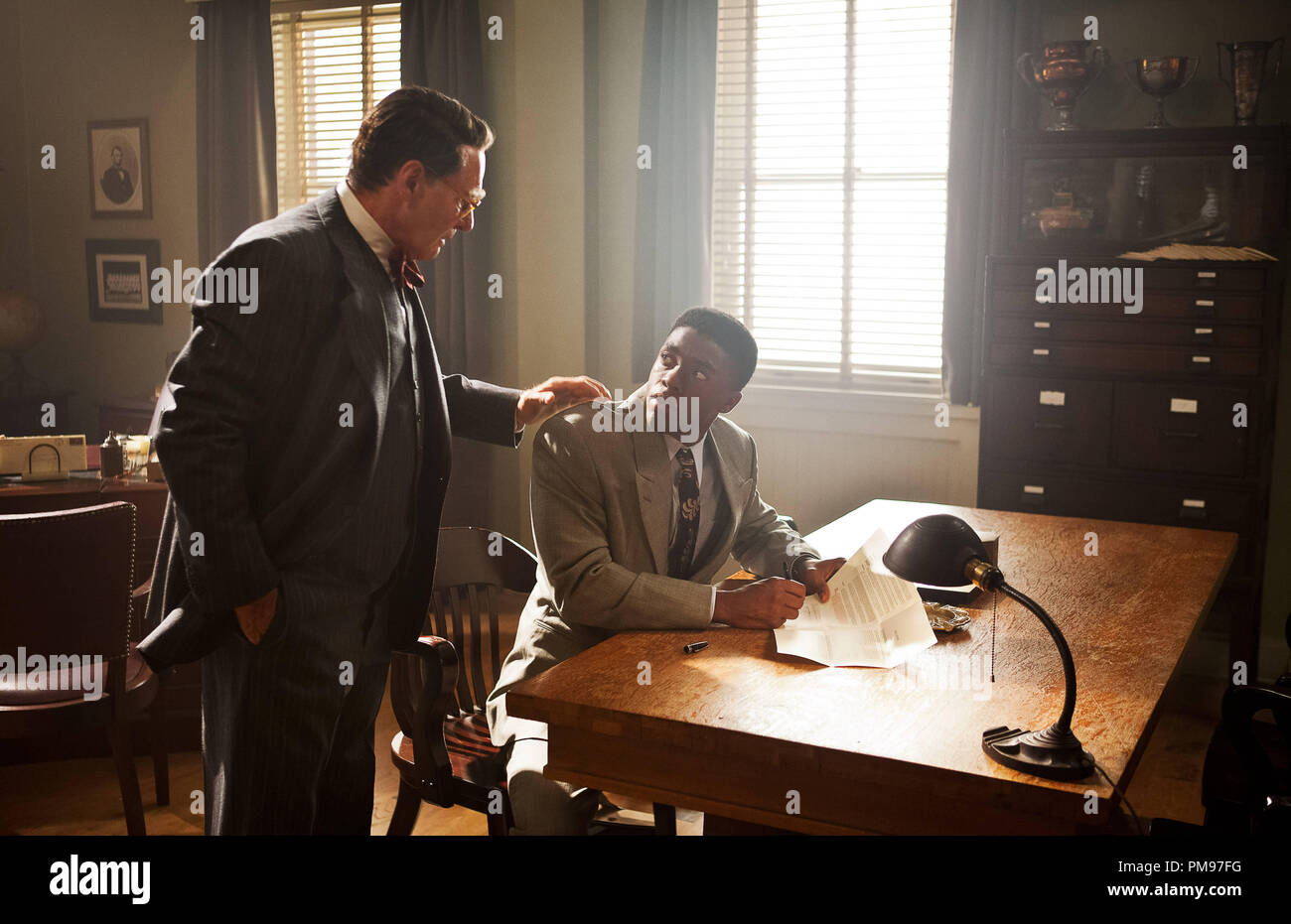 (L-r) HARRISON FORD as Branch Rickey and CHADWICK BOSEMAN as Jackie ...