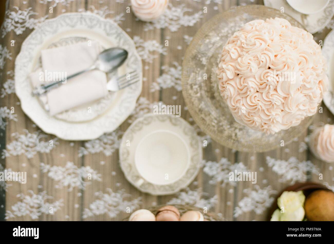 Lacey table design with cupcakes, petite fours, macroons and sweets for ...