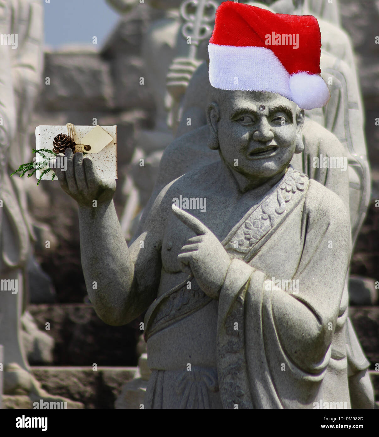 Pointing monk statue hi-res stock photography and images - Alamy