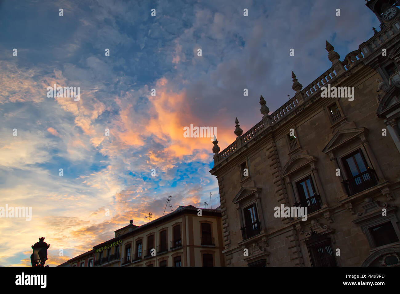 Granada streets in a historic city center at sunset Stock Photo - Alamy