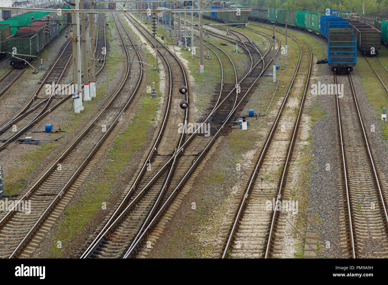 Freight trains, wagons with cargo stand on the railroad tracks of the ...