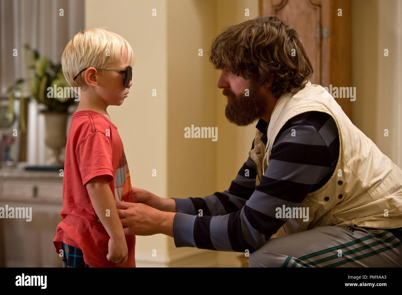 (L-r) GRANT HOLMQUIST as Tyler/Carlos and ZACH GALIFIANAKIS as Alan in ...