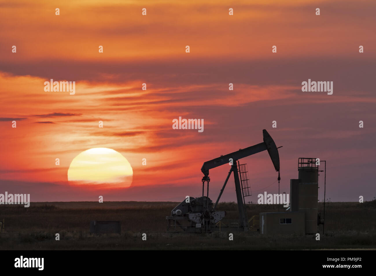 Silhouette oil field storage tanks hi-res stock photography and images ...