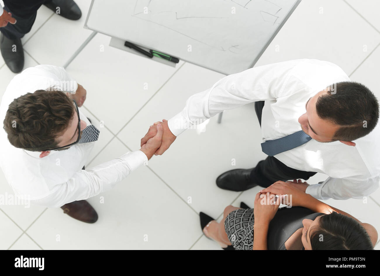 view from the top. background image of handshake of business partners ...