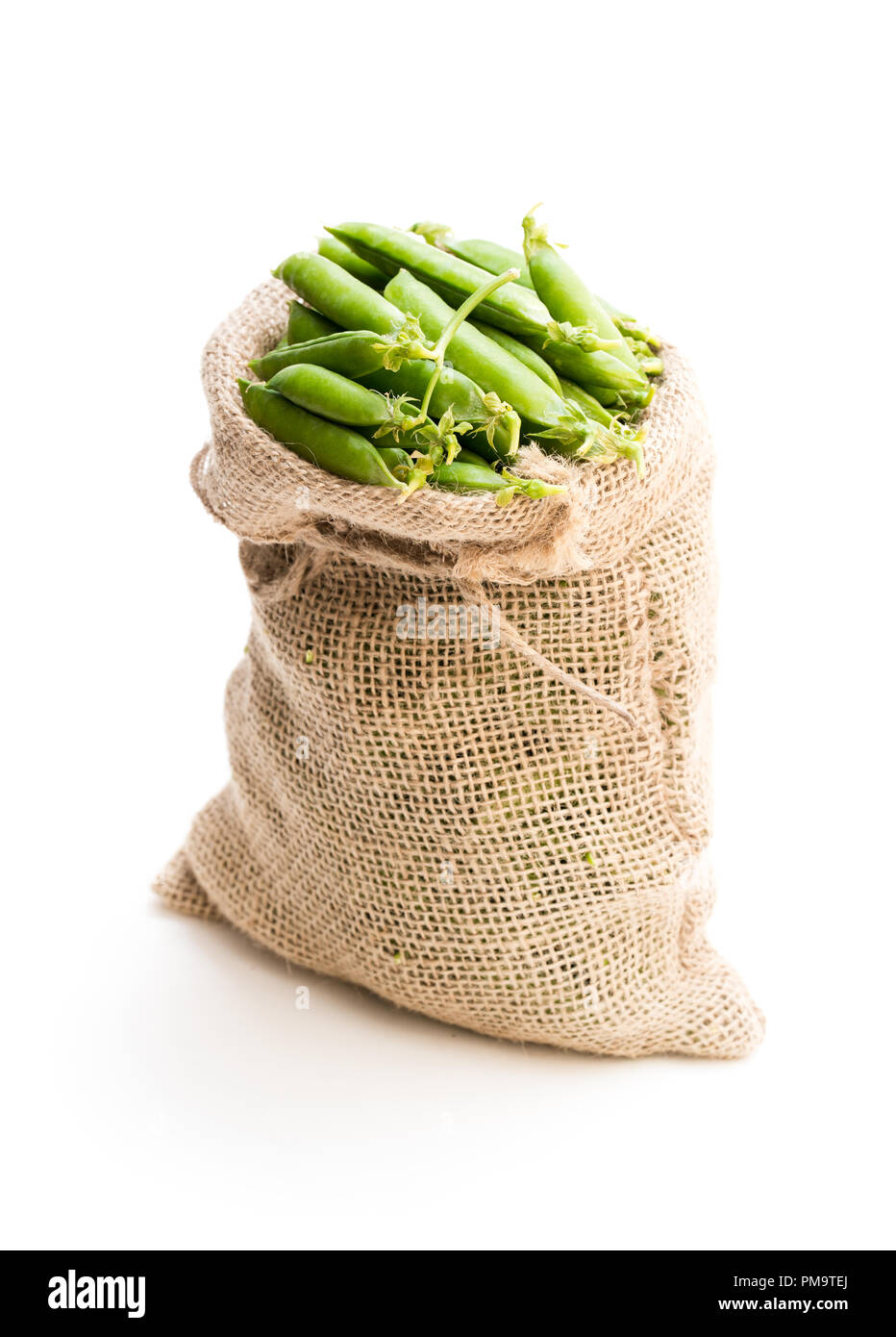 Fresh green pea pods in sack bag isolated on white Stock Photo - Alamy
