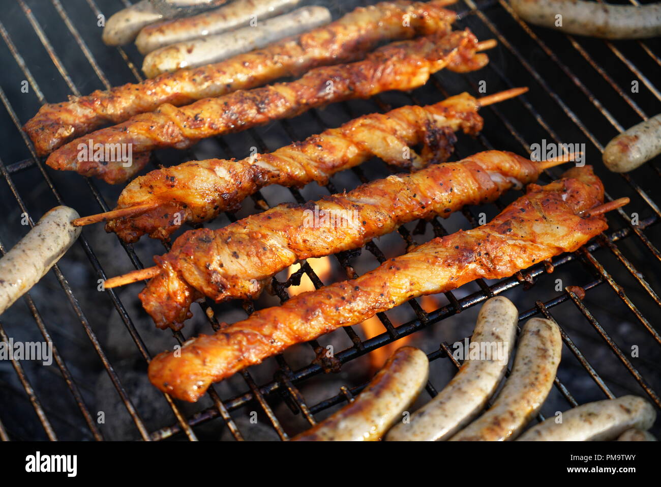 Sausages barbecue with a charcoal barbecue in the garden Stock Photo ...