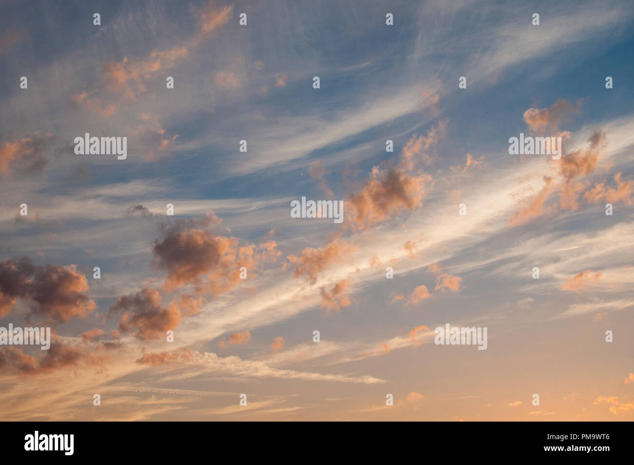 Sky full of pink clouds during sunset Stock Photo - Alamy