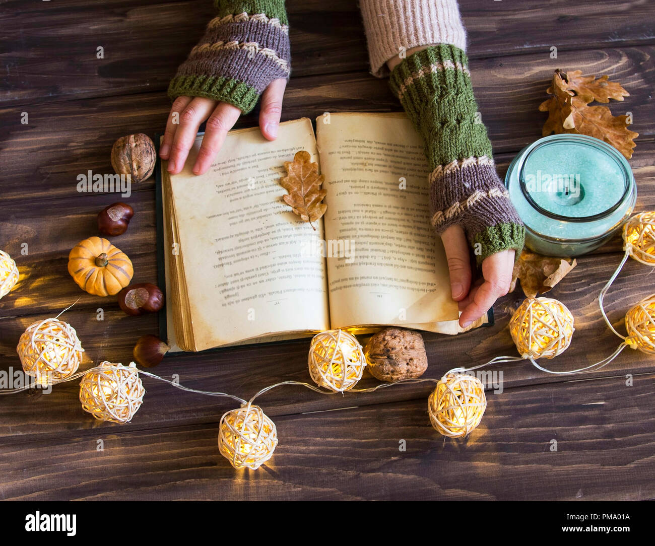 Book reading woman candle hi-res stock photography and images - Alamy