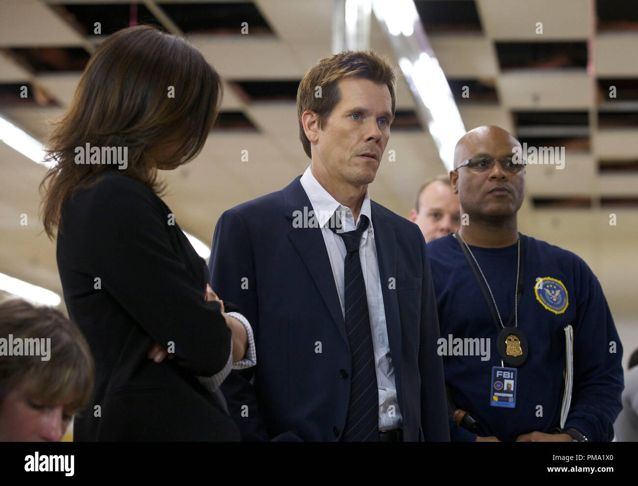 THE FOLLOWING: Former FBI agent Ryan Hardy (Kevin Bacon, C) is brought ...