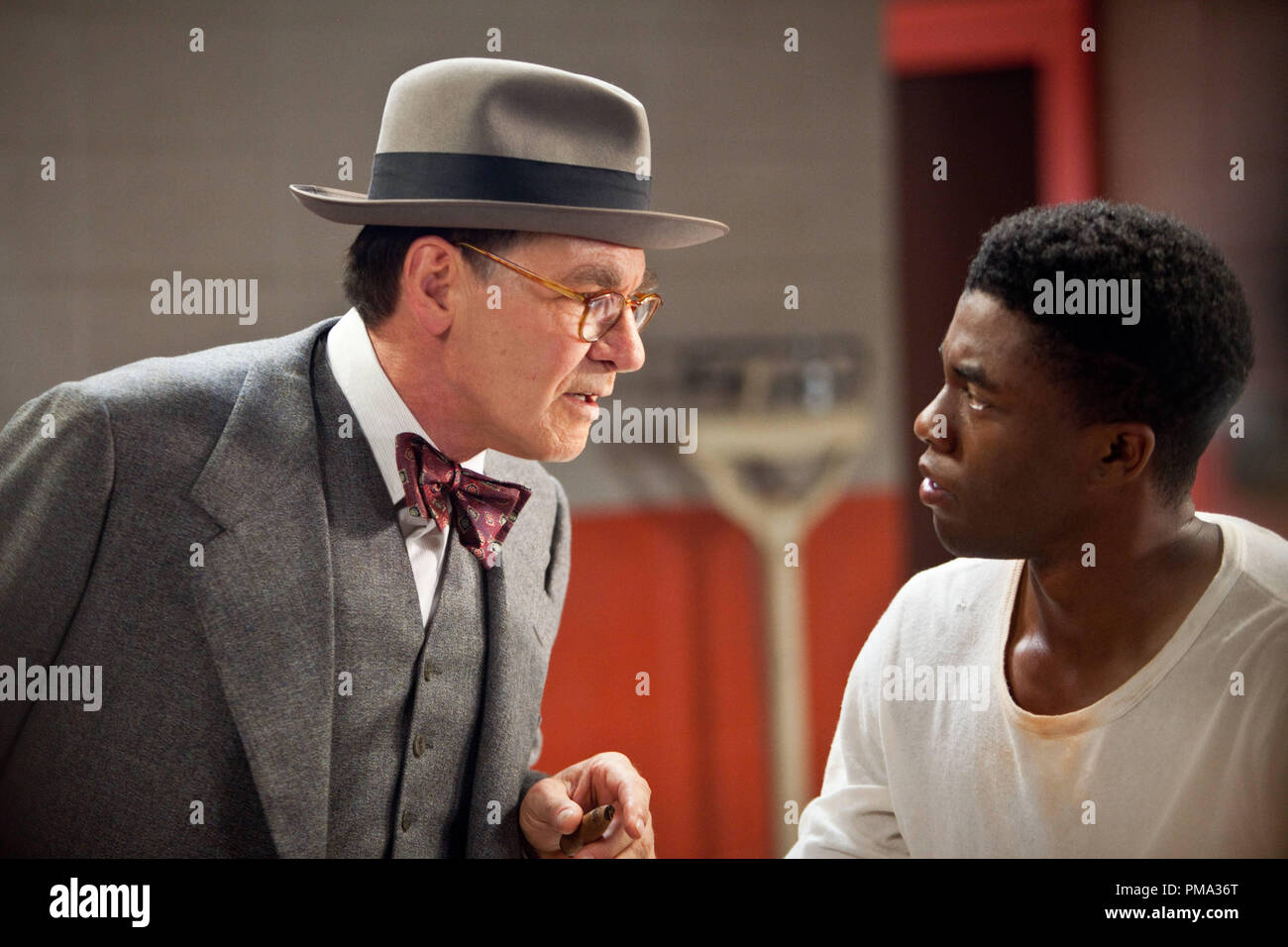 (L-r) HARRISON FORD as Branch Rickey and CHADWICK BOSEMAN as Jackie ...
