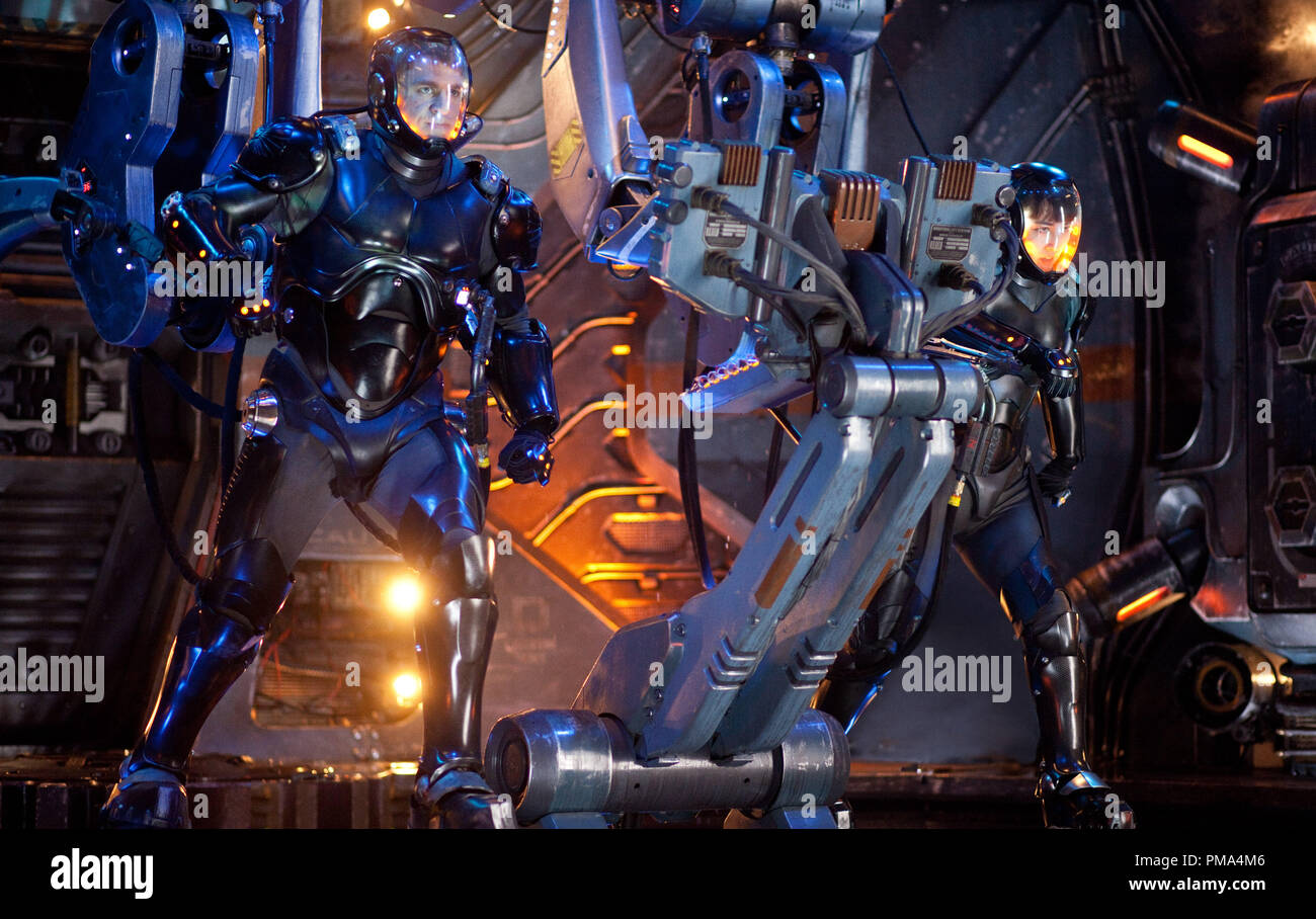 (L-r) CHARLIE HUNNAM as Raleigh Becket and RINKO KIKUCHI as Mako Mori ...