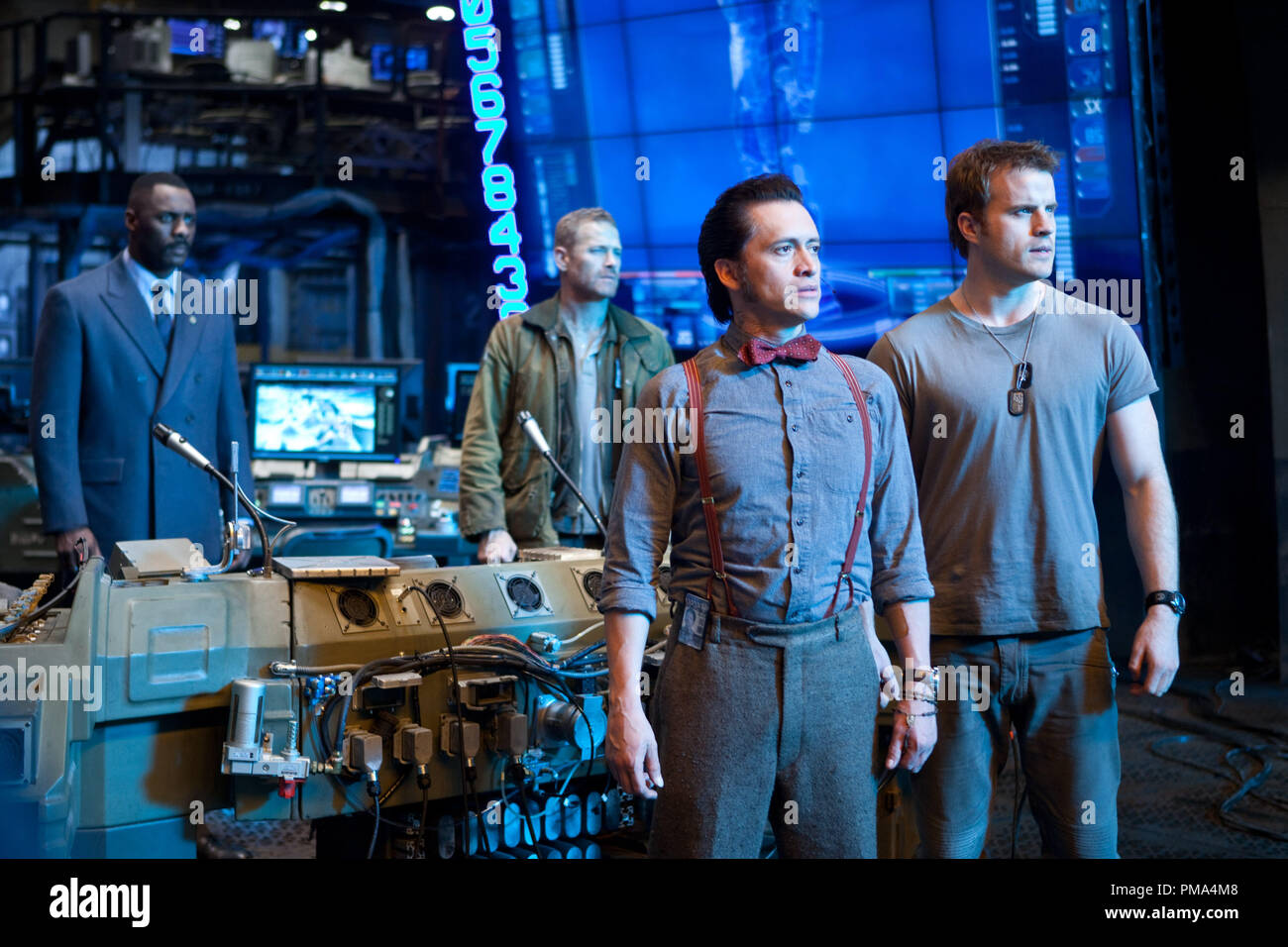 (L-r) IDRIS ELBA as Stacker Pentecost, MAX MARTINI as Herc Hansen ...