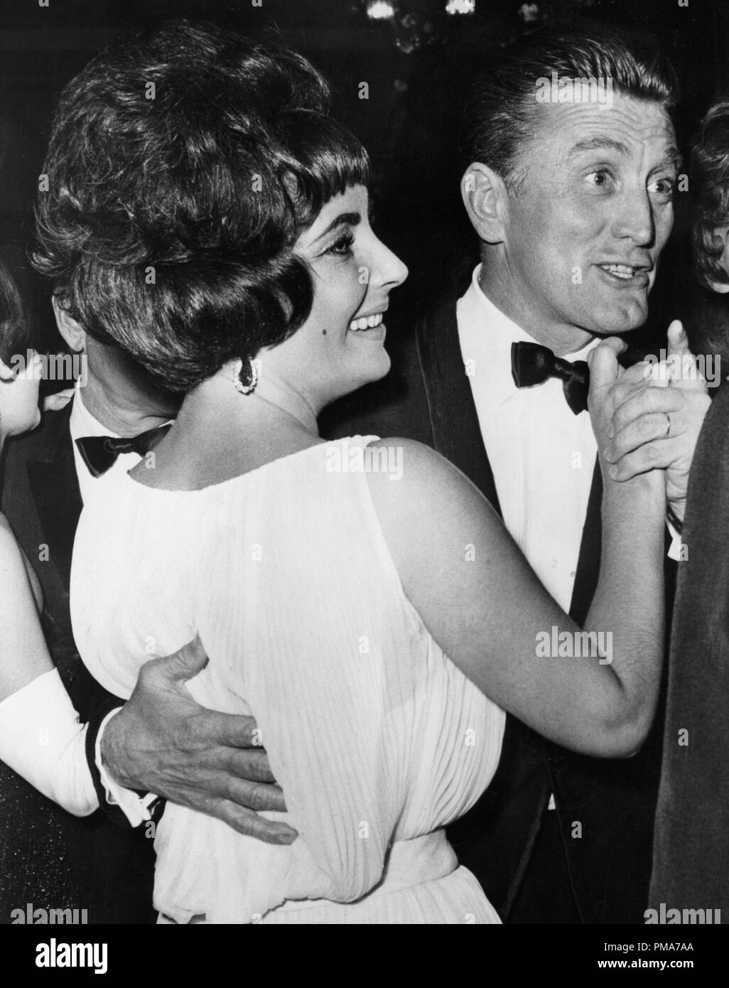 Elizabeth Taylor with Kirk Douglas at a party in Rome for the film ...