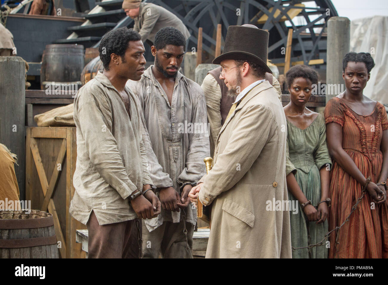 Chiwetel Ejiofor (far left) as 'Solomon Northup' and Paul Giamatti as ...