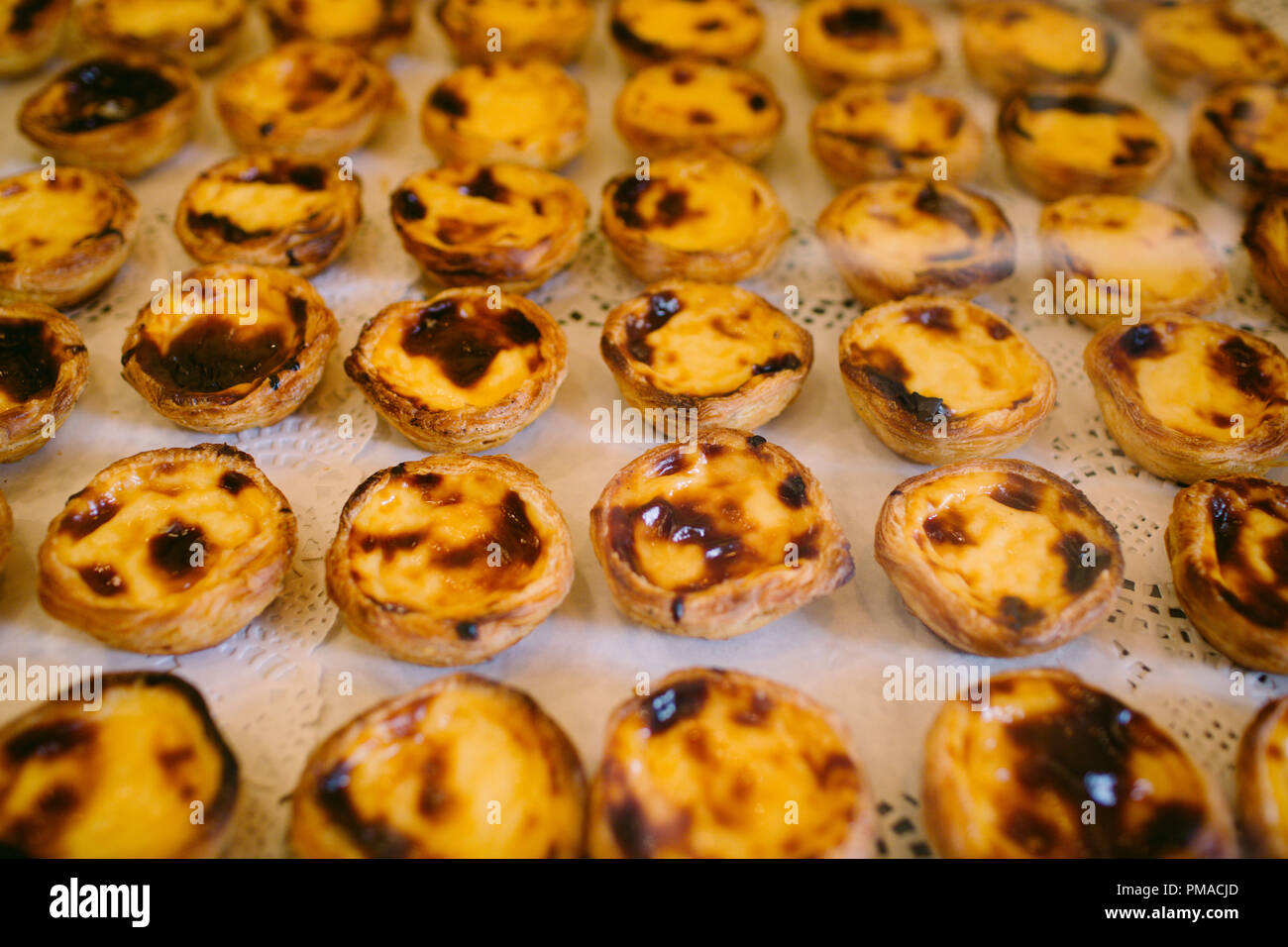 Traditional Portuguese cakes Pastel de Nata (custard tarts) laid out on ...