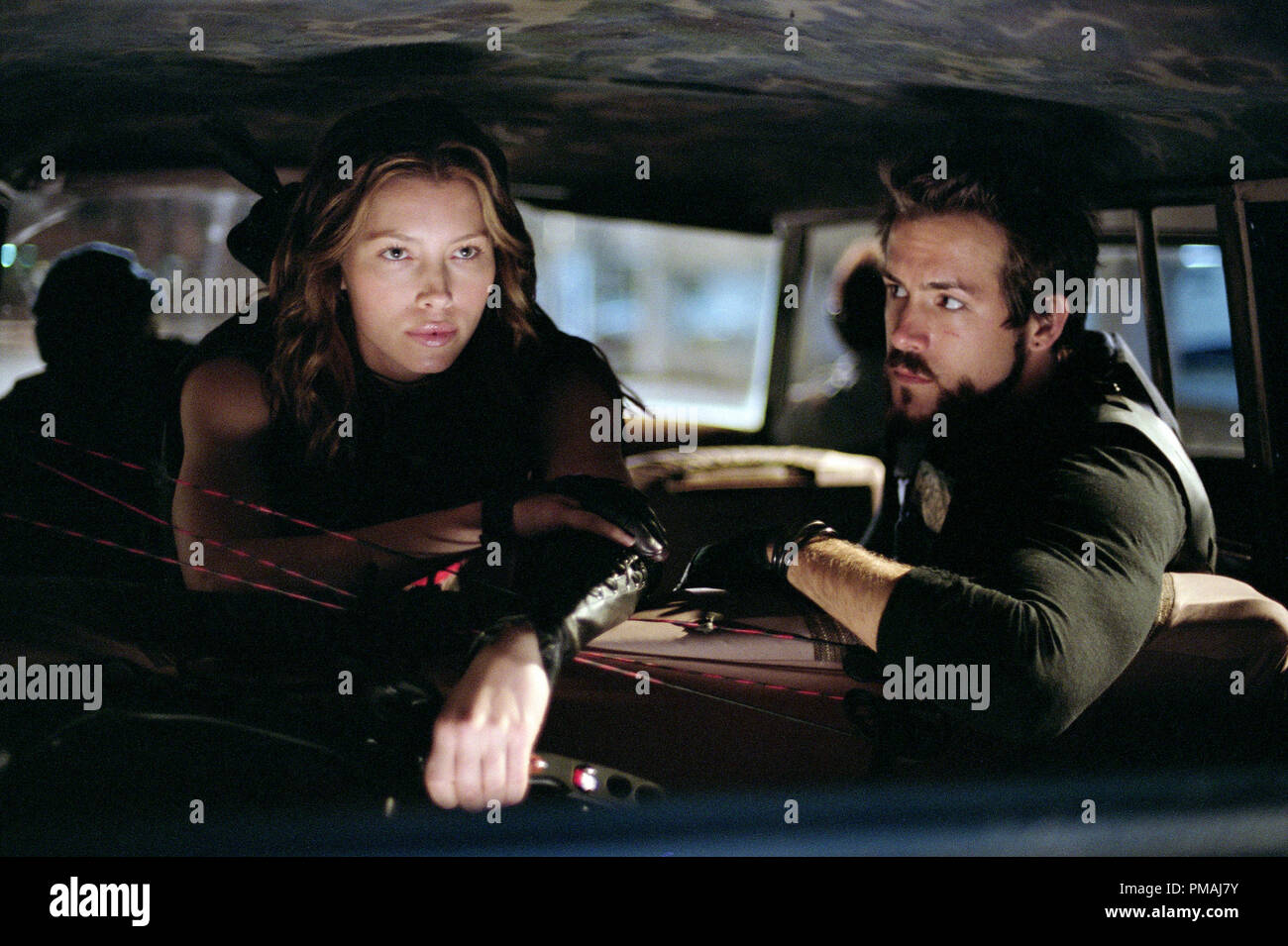 Jessica Biel (left) and Ryan Reynolds (right) star in New Line Cinema's action-adventure, BLADE ...