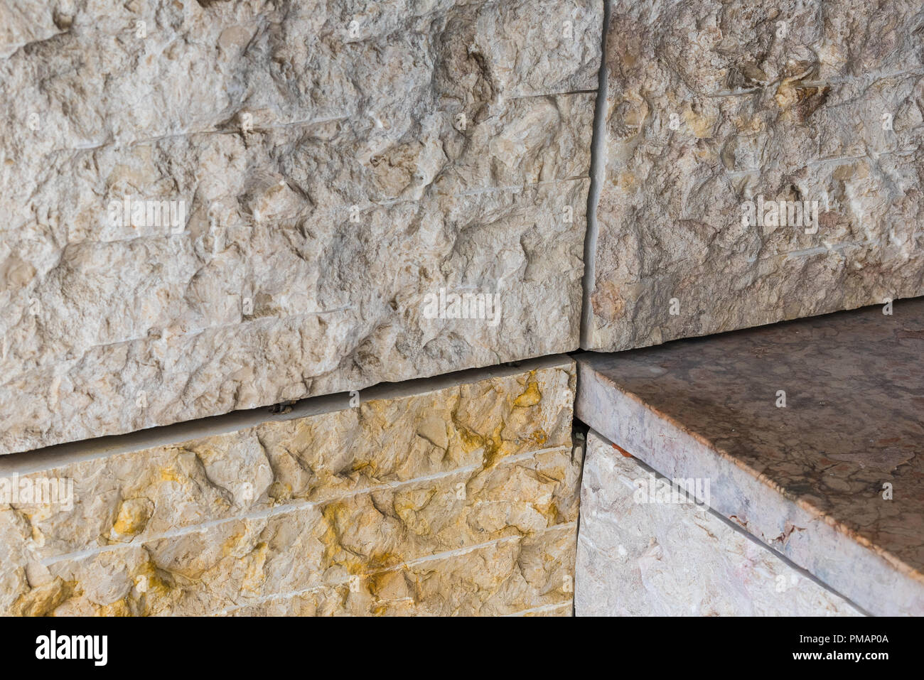 Symmetrical horizontal vertical angled lines of stone tiles of modern ...