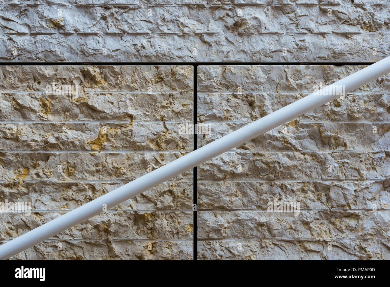 Symmetrical horizontal vertical angled lines of stone tiles of modern ...