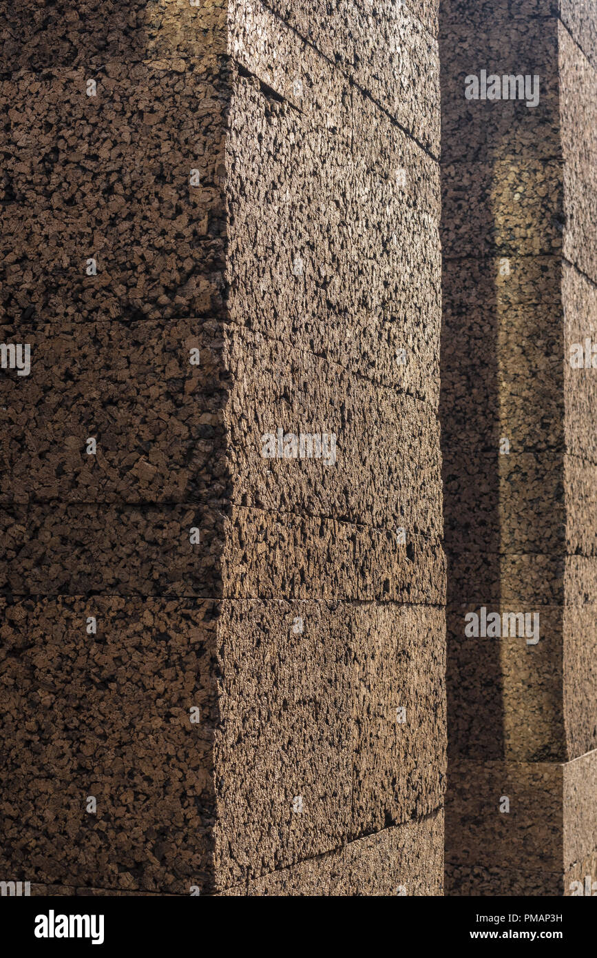 Different size cork bales stacked in columns in public path Stock Photo ...