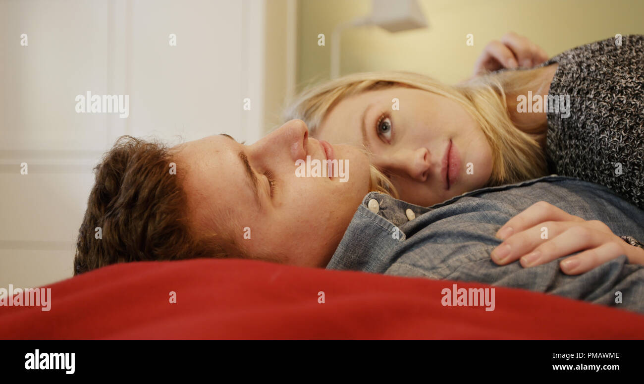 Couple Cuddling Bed Stock Photos & Couple Cuddling Bed Stock Images - Alamy