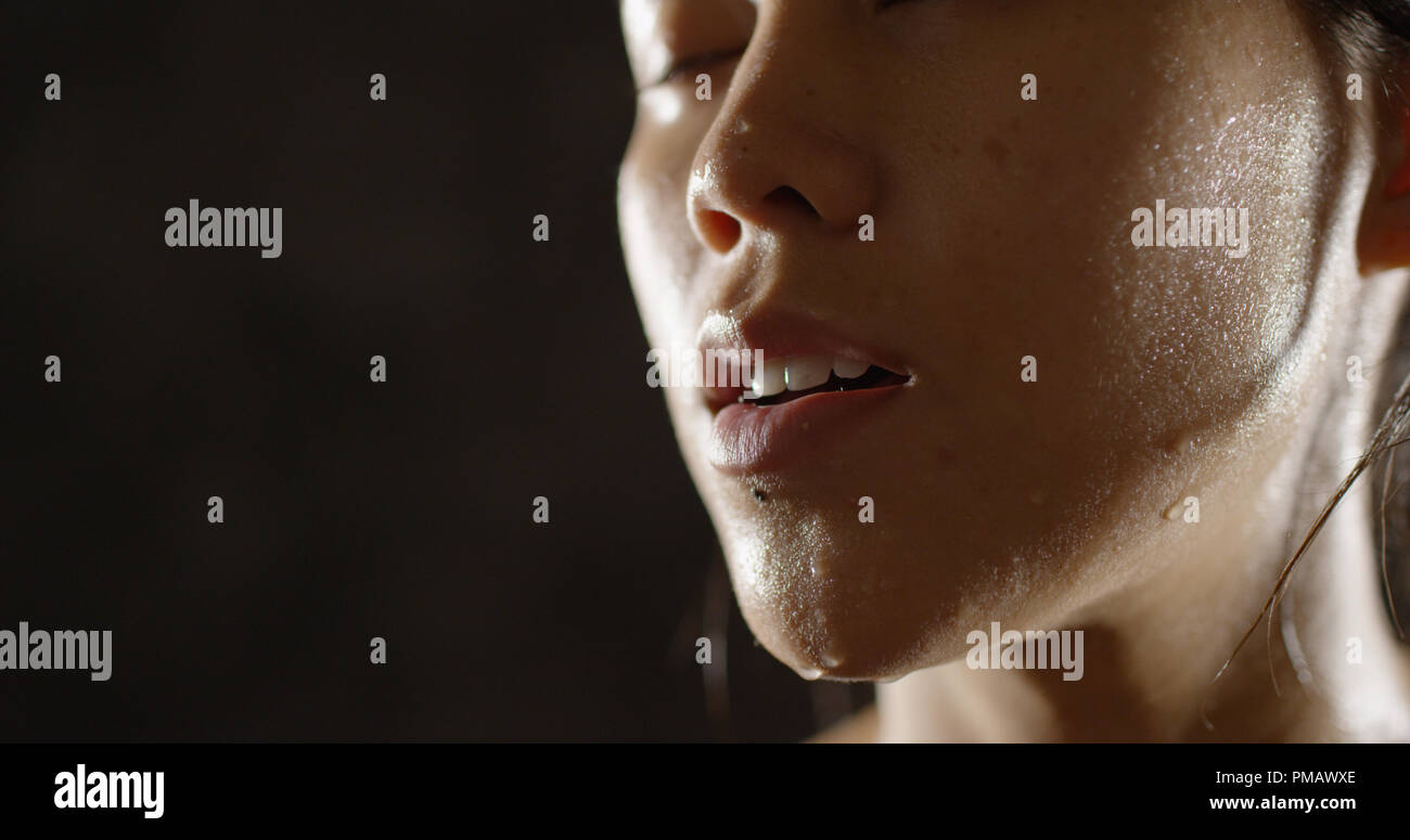 Portrait of athletic woman sweating taking a break from workout Stock ...