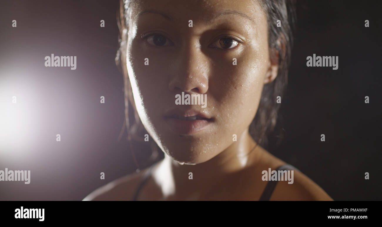 Portrait of athletic woman sweating taking a break from workout Stock ...