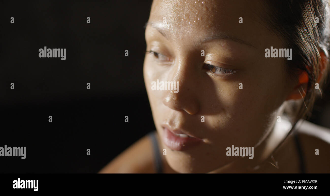 Close up of Athletic woman sweating taking a break after work out Stock ...