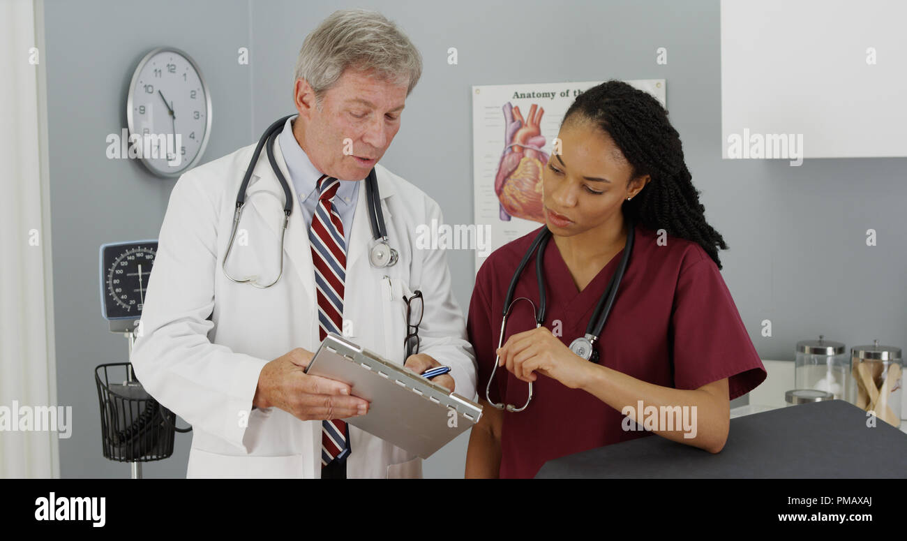 Two Doctors discussing patient's results Stock Photo - Alamy
