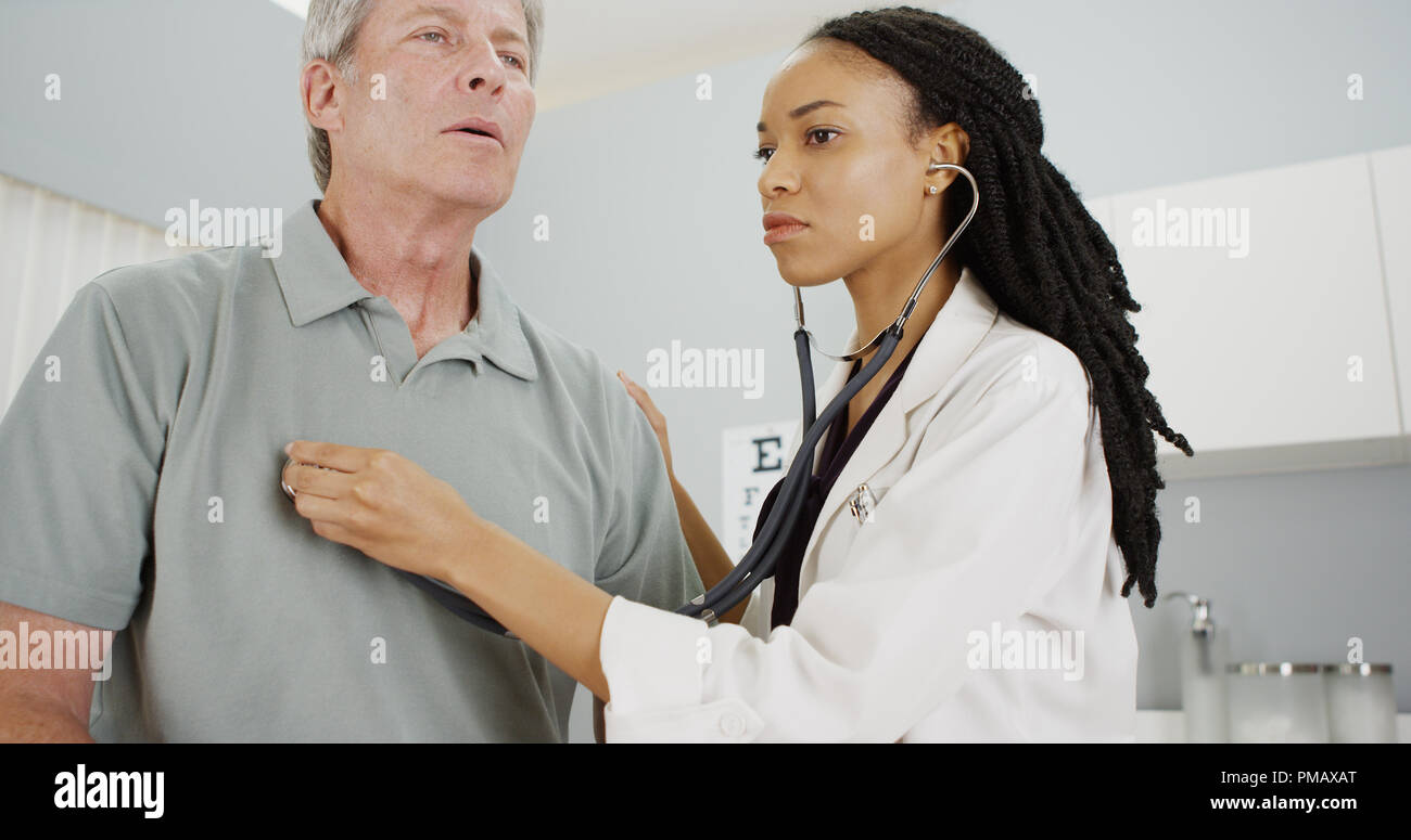 African american doctor writing checkup hi-res stock photography and ...
