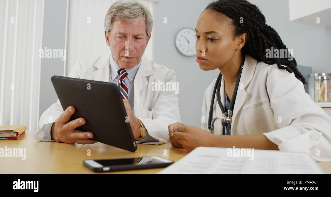 Doctors working together in the office Stock Photo - Alamy