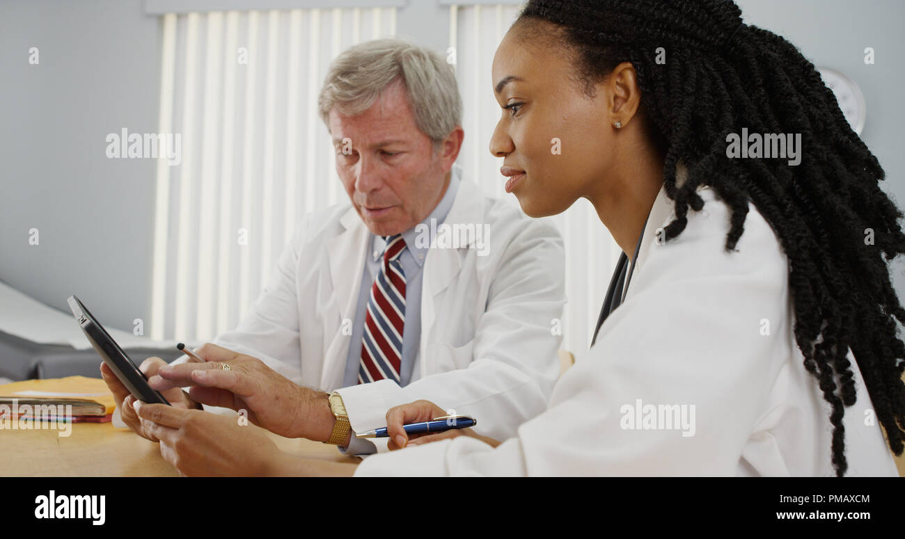 Friendly medical professional working together hi-res stock photography ...