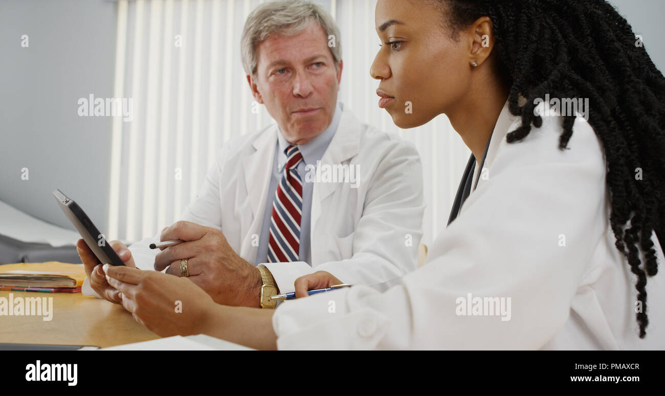 Two doctors sitting together hi-res stock photography and images - Alamy